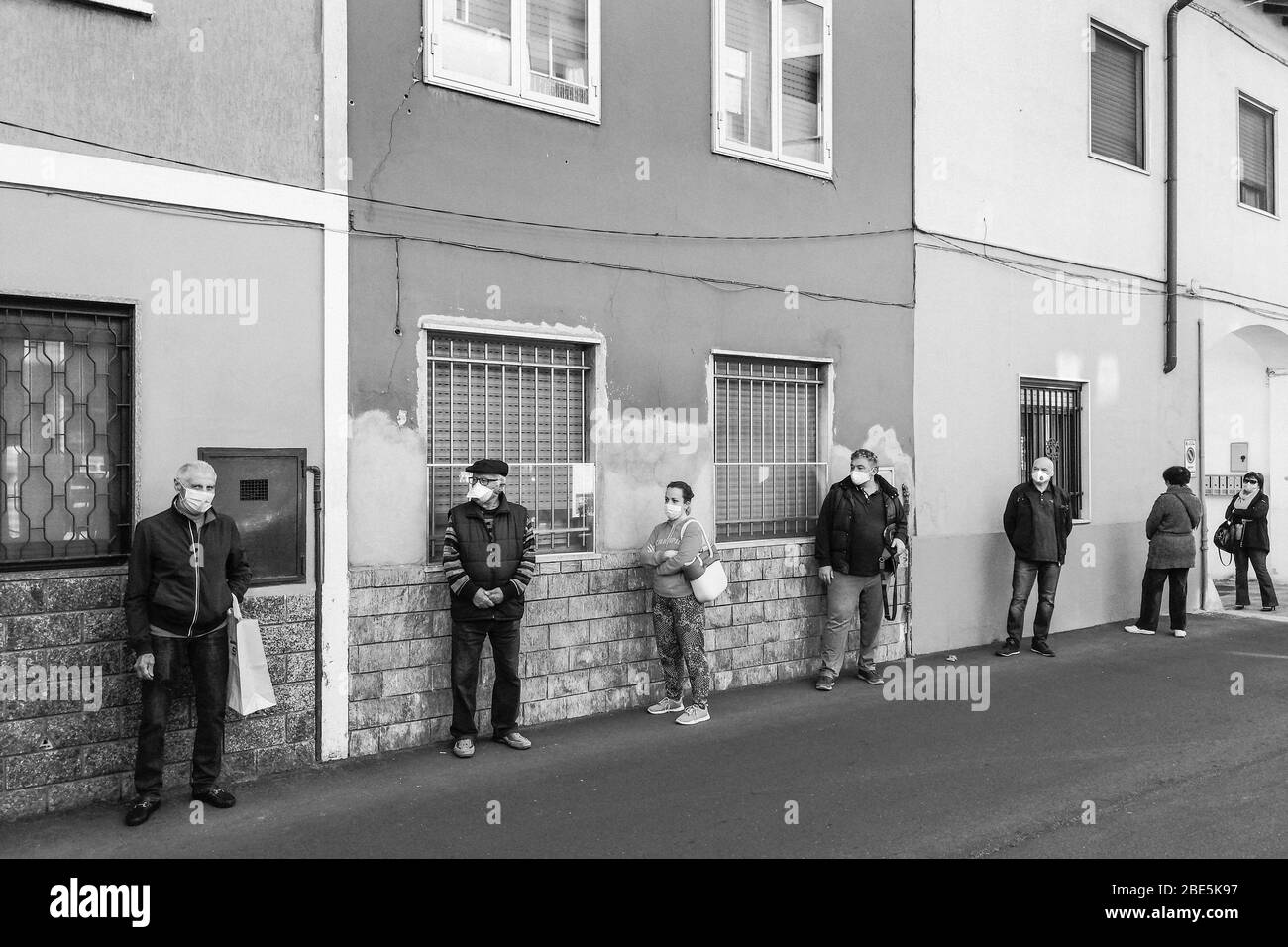 Italy, Lombardy, Ossona, people in line to buy bread Stock Photo - Alamy
