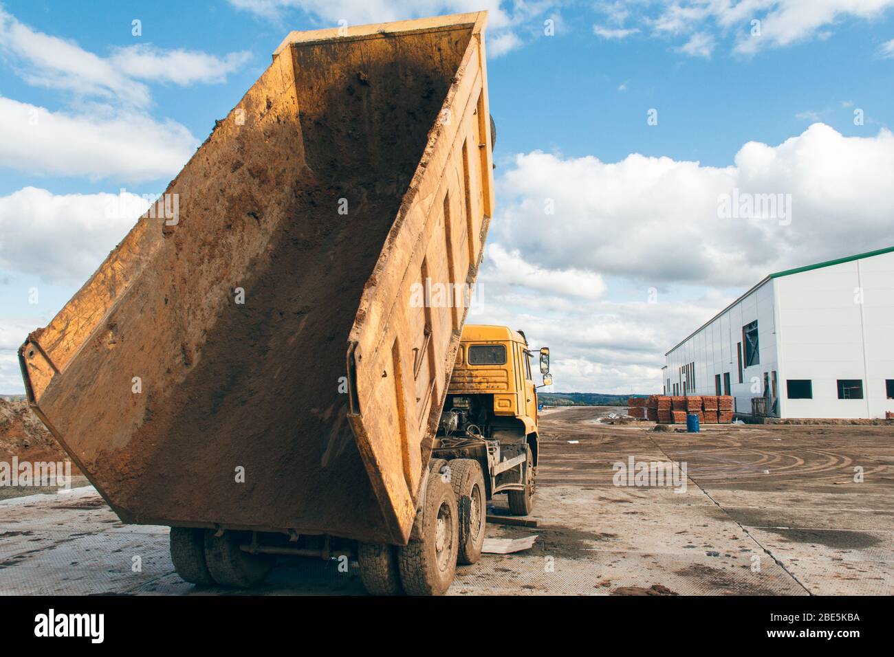Old dump truck at a construction site. Equipment for construction Stock ...