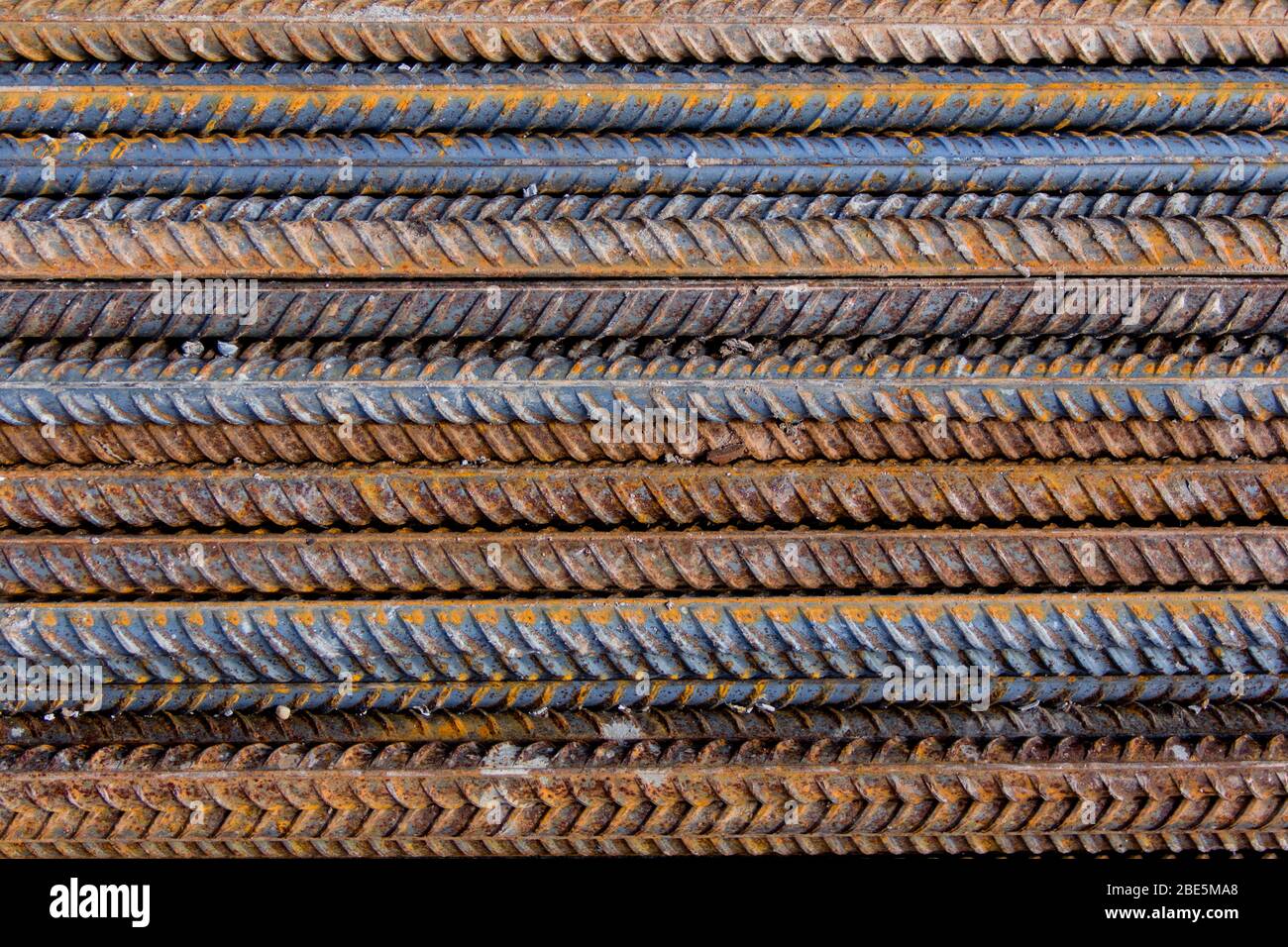 Construction rebar with traces of rust. Industrial background. The use ...