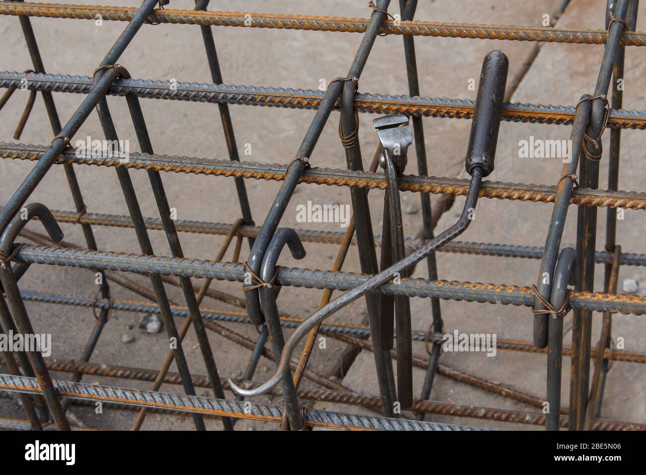Workers tool for steel rebar for building in construction site. Pincers ...