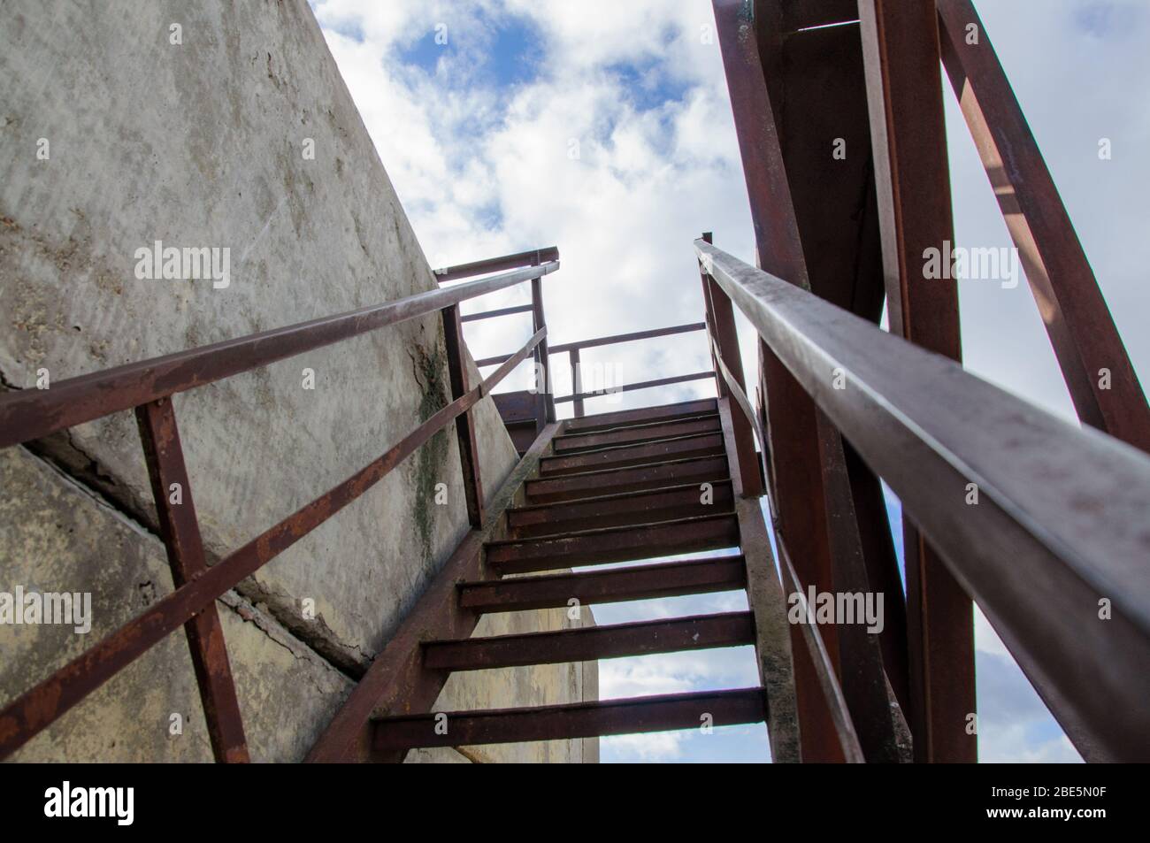 Evacuation staircase leading to a rooftop of a building. Fire exit from ...