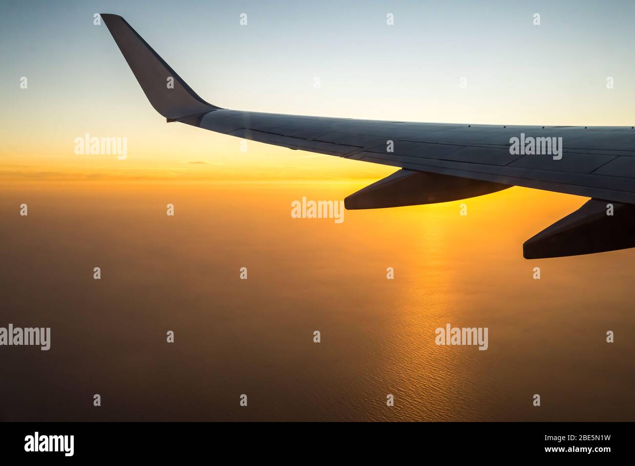 Beautiful sunset, sky on top view, airplane flying view from inside the ...