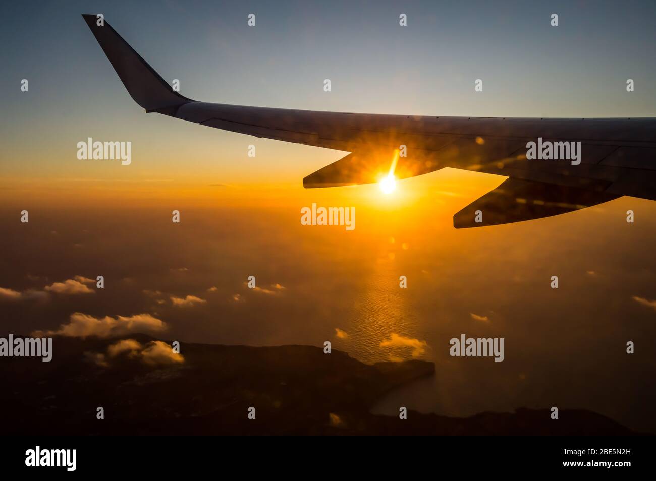 Beautiful sunset, sky on top view, airplane flying view from inside the ...