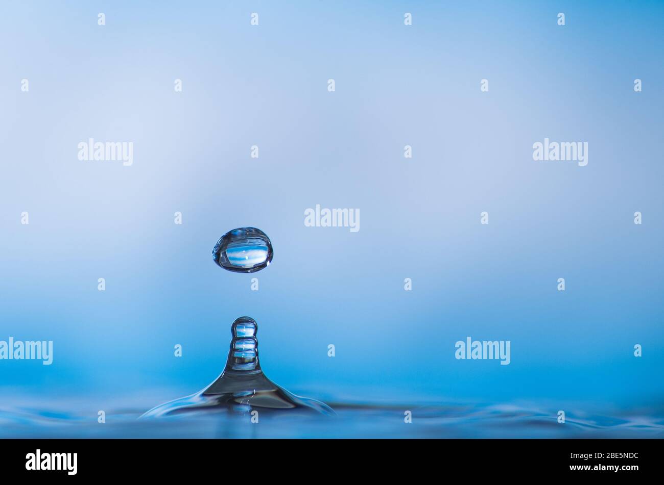 High speed photograph of water drops falling and splashing Stock Photo ...