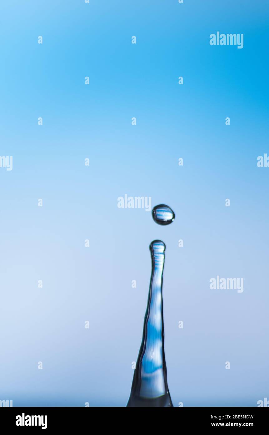 High speed photograph of water drops falling and splashing Stock Photo ...