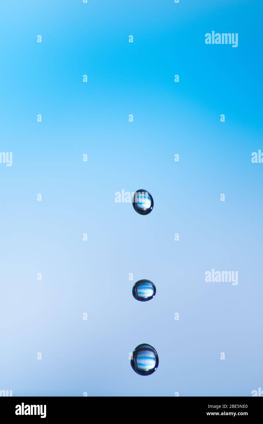 High speed photograph of water drops falling and splashing Stock Photo ...