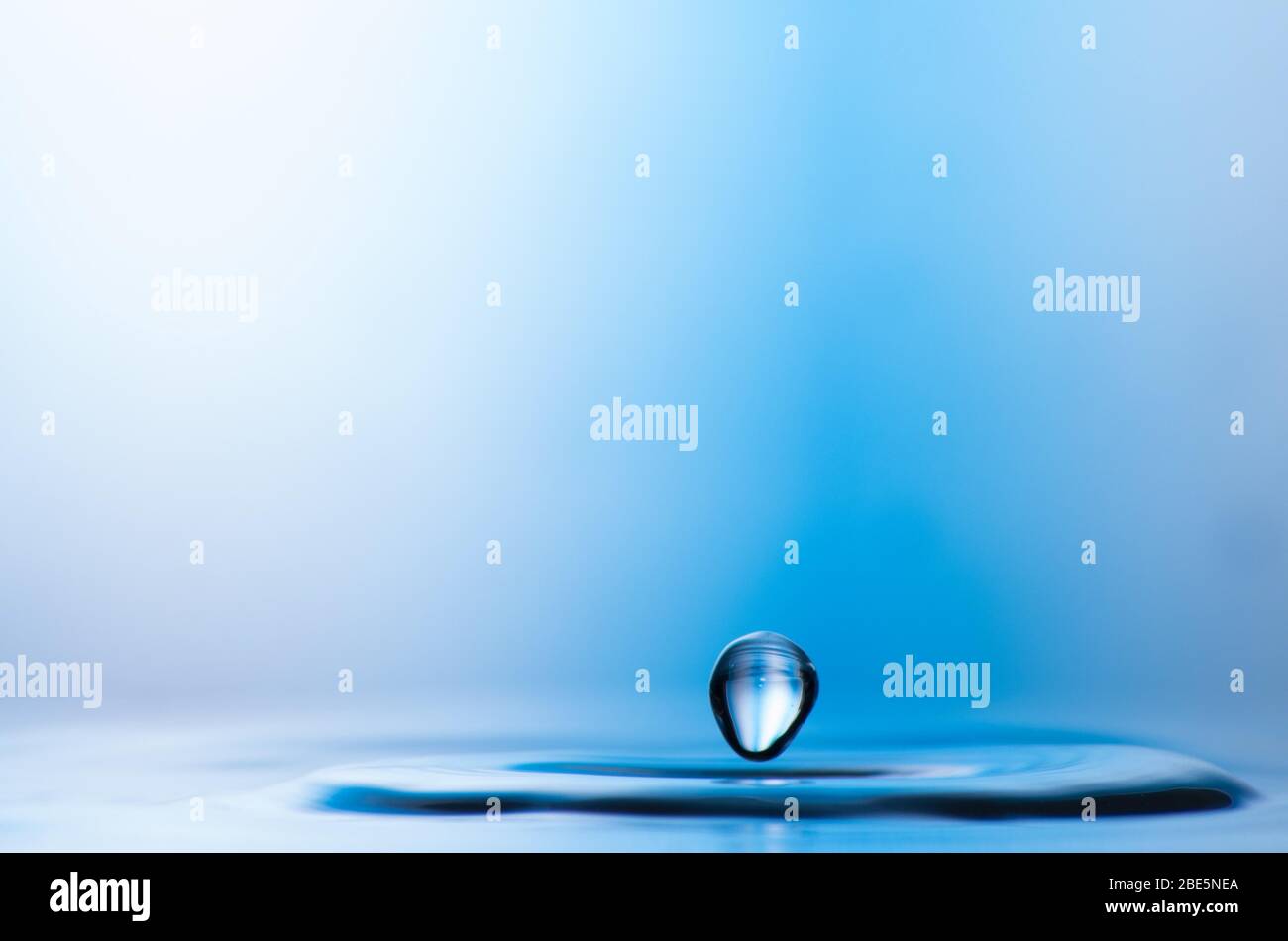 High speed photograph of water drops falling and splashing Stock Photo ...