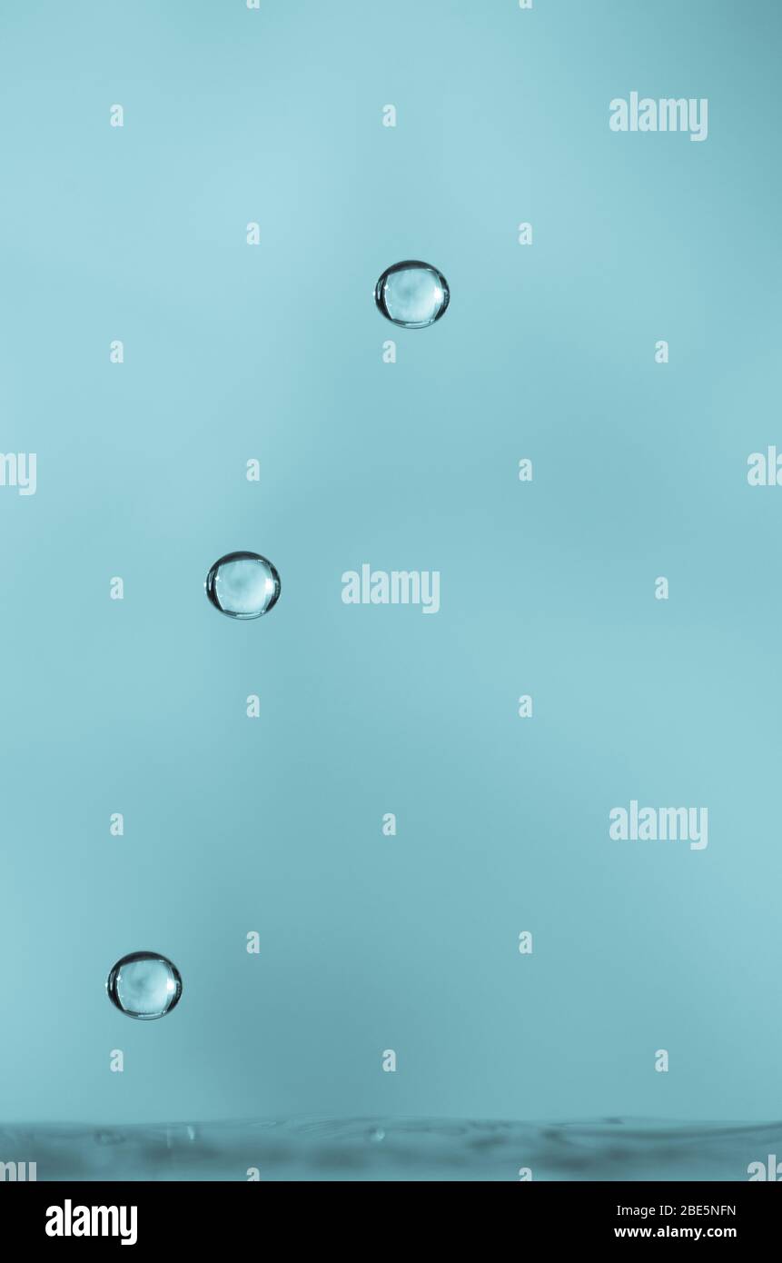 Blue water drop falling down hi-res stock photography and images - Alamy