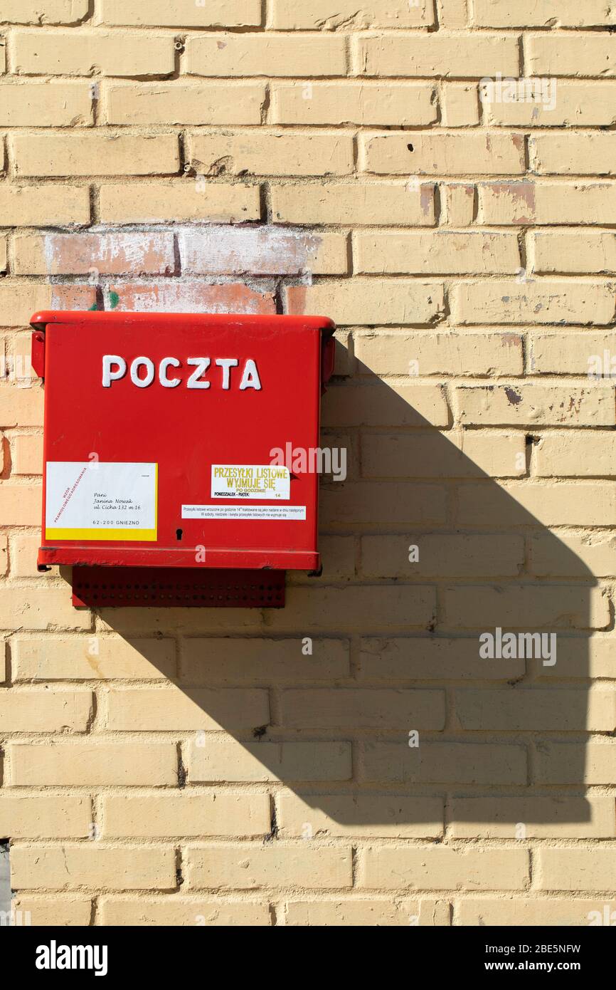 Post box and its shadow. Polish post office "Poczta Polska", Gniezno ...