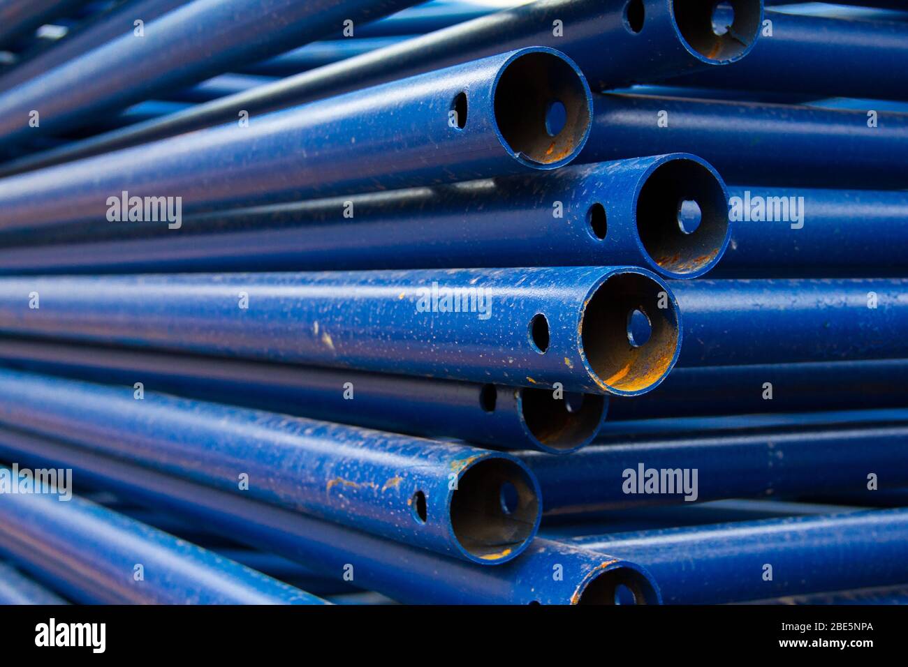 Close-up of the basics for scaffolding. Stacked steel pipe frame for ...