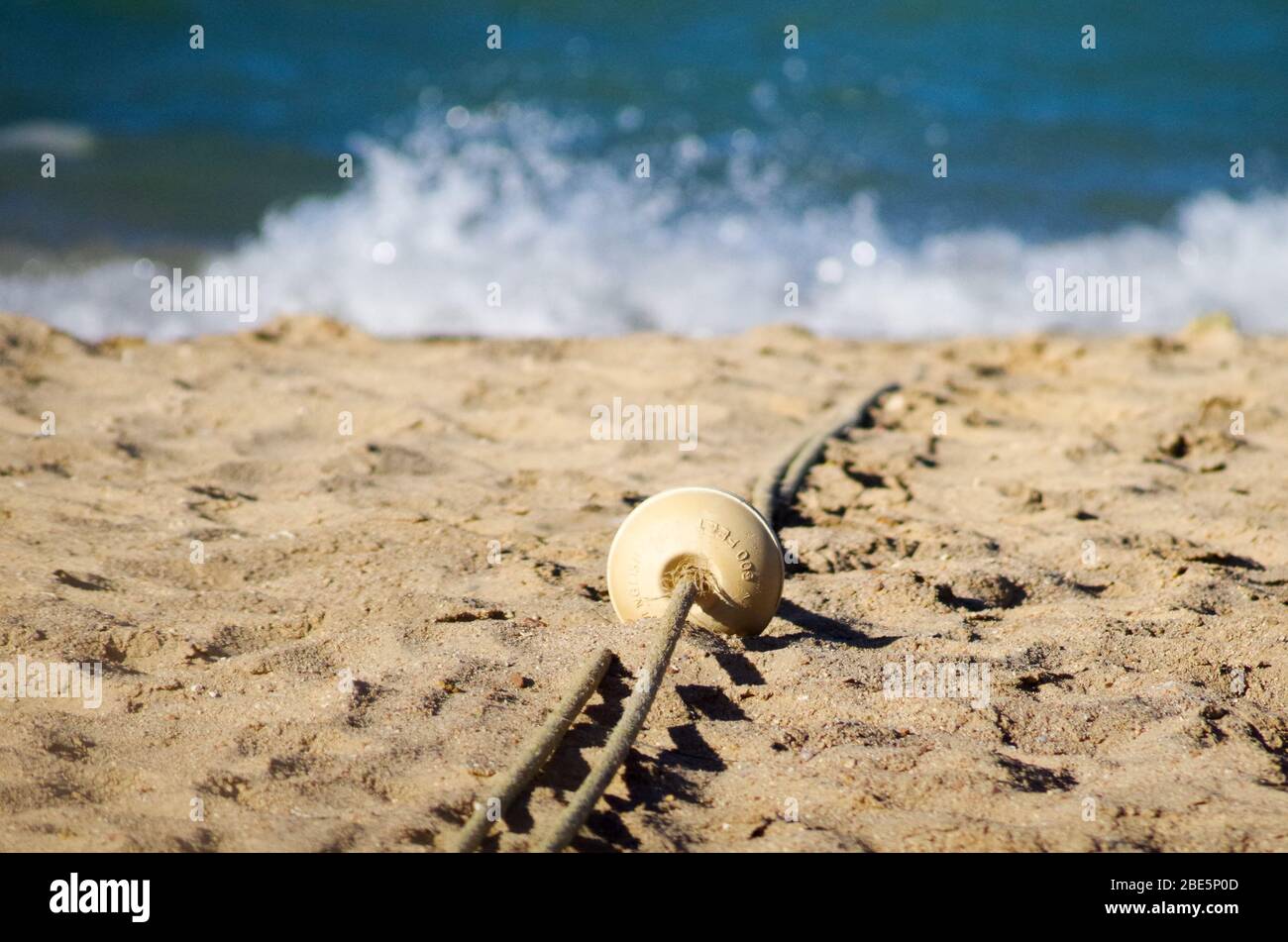 A beach bouy lying in the sun on a beach Stock Photo - Alamy