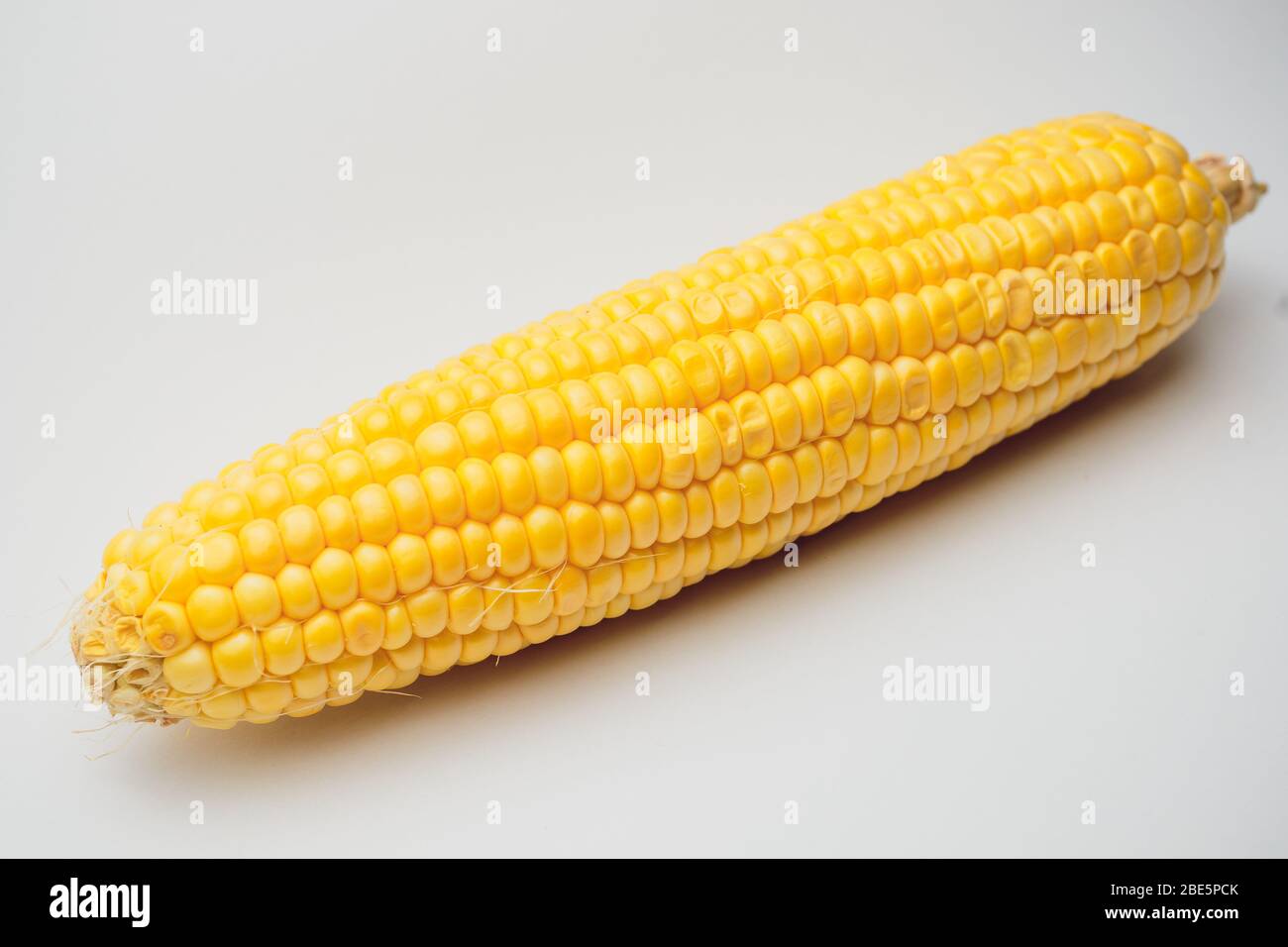 fresh corn vegetable with green leaves isolated on white background ...