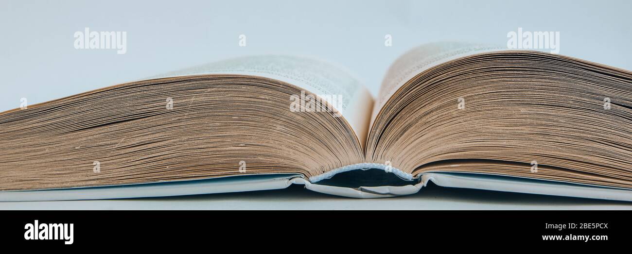 Closeup of a hardcover book open in the middle, Open book Stock Photo ...