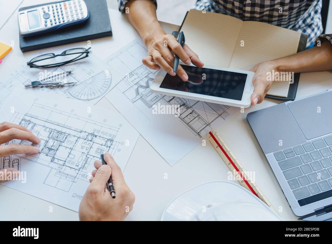 engineer Hand Drawing Plan On Blue Print with architect equipment ...