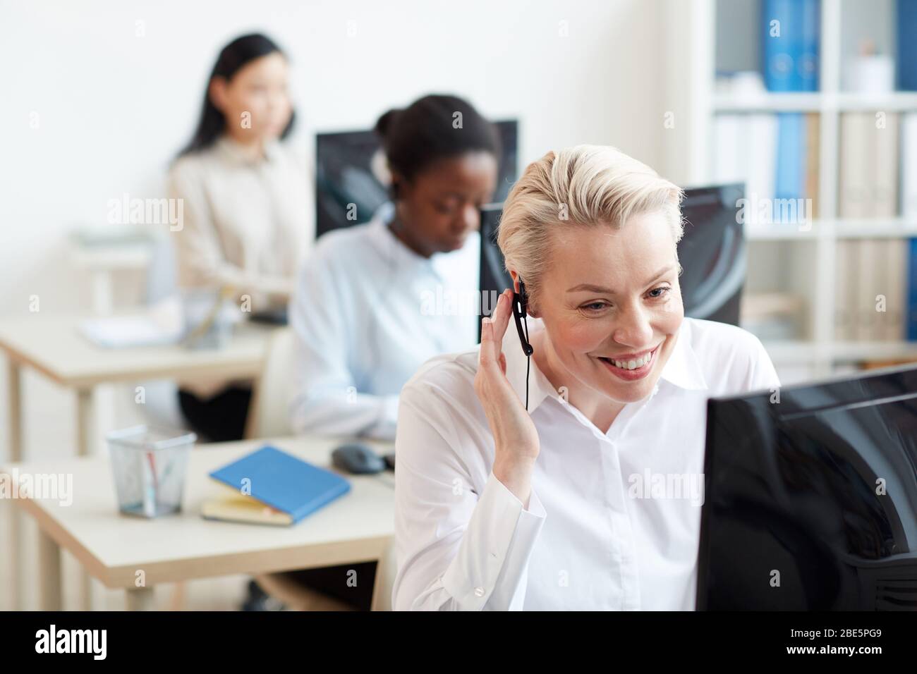 Woman smiling talking on mic hi-res stock photography and images - Alamy