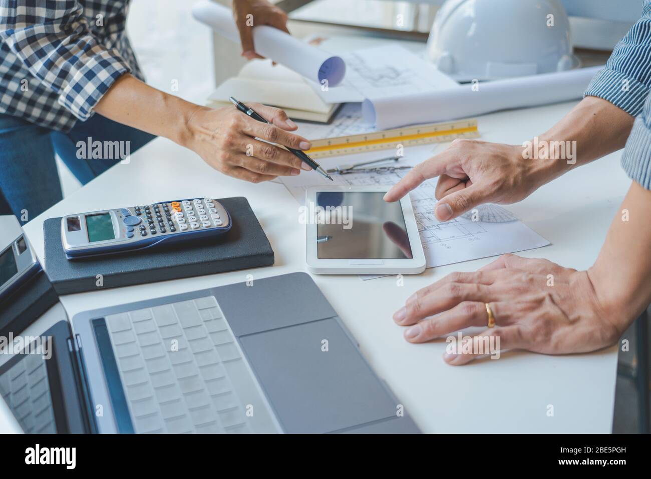 engineer Hand Drawing Plan On Blue Print with architect equipment ...