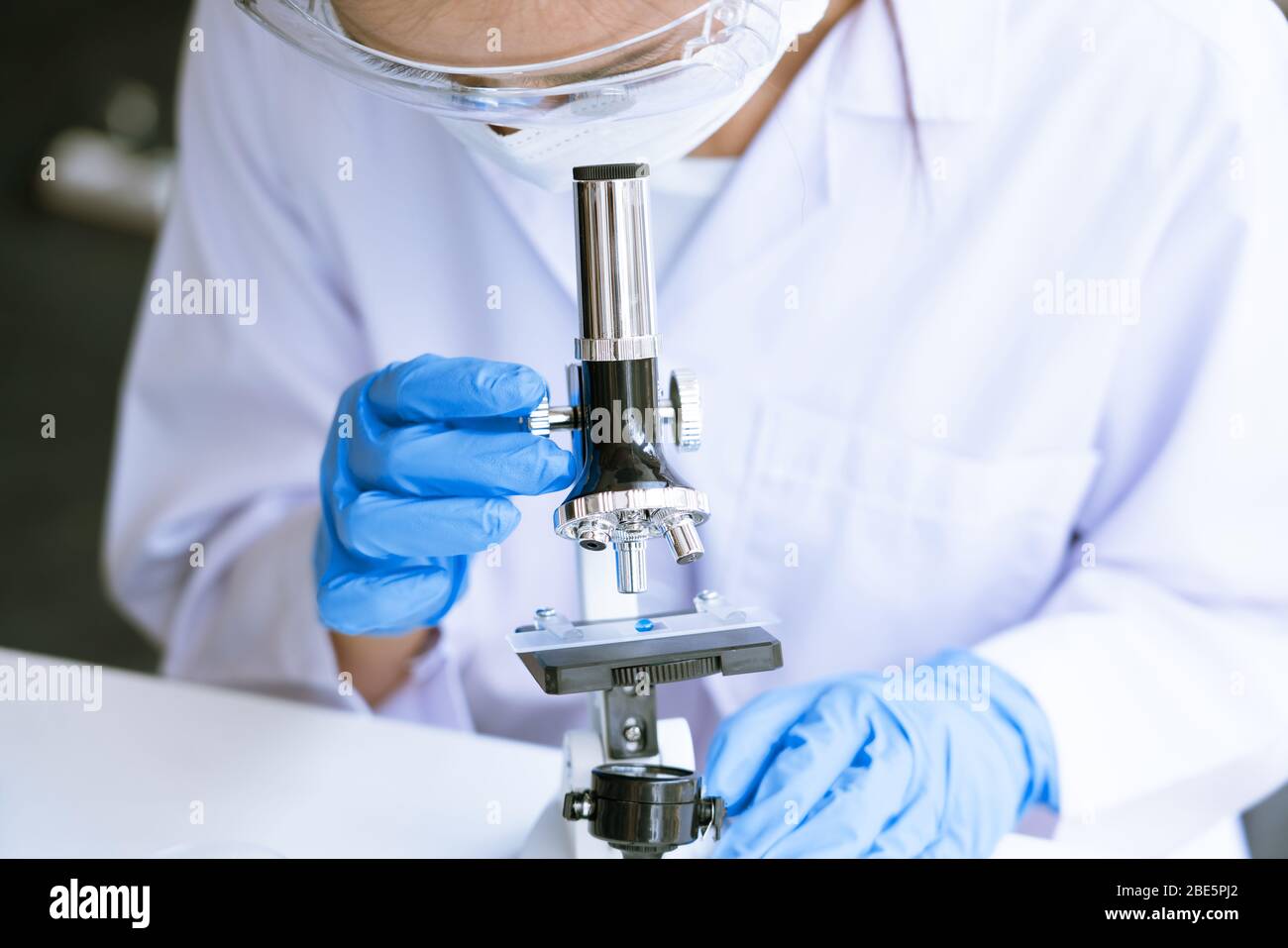 Medical Research asian Scientist Working With Microscope Doing Research ...