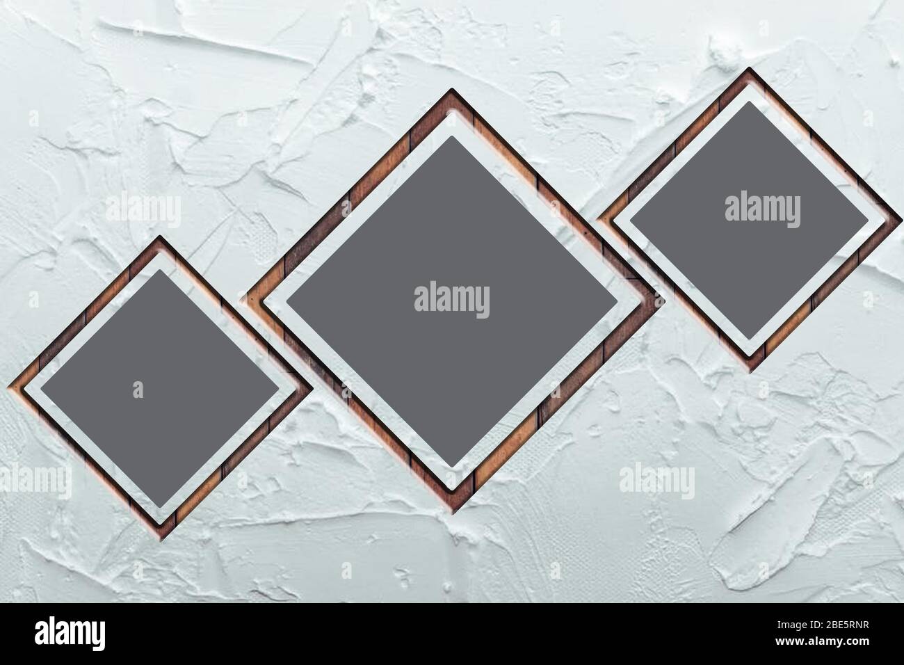 Diamond shape frames on a rugged white wall. Empty frames Stock Photo ...