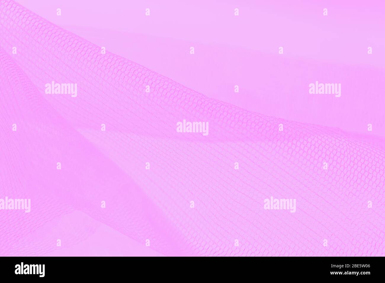 Light small mesh fabric on pink background. Shades of pink Stock Photo ...
