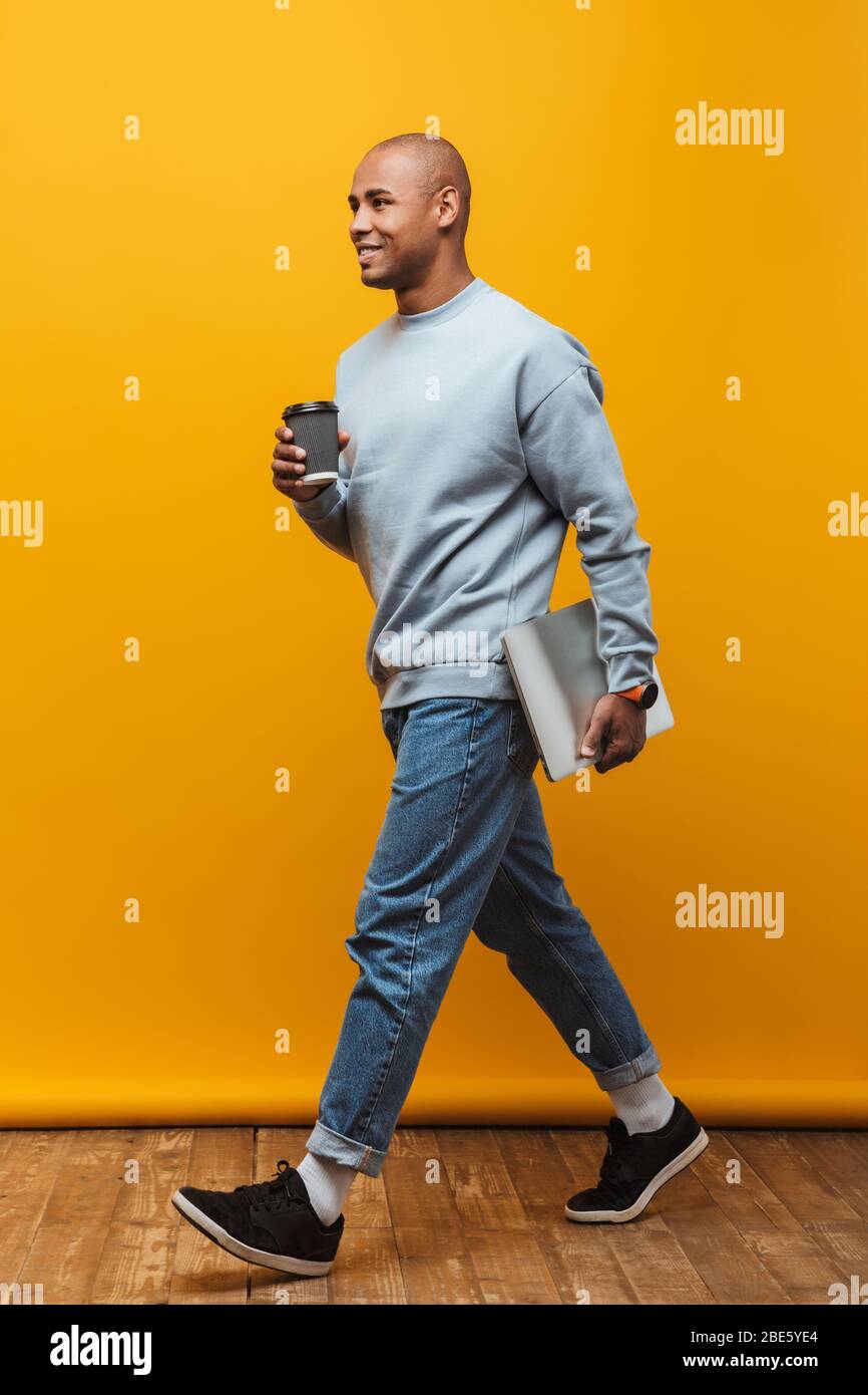 Full length portrait of an attractive happy confident casual young man ...