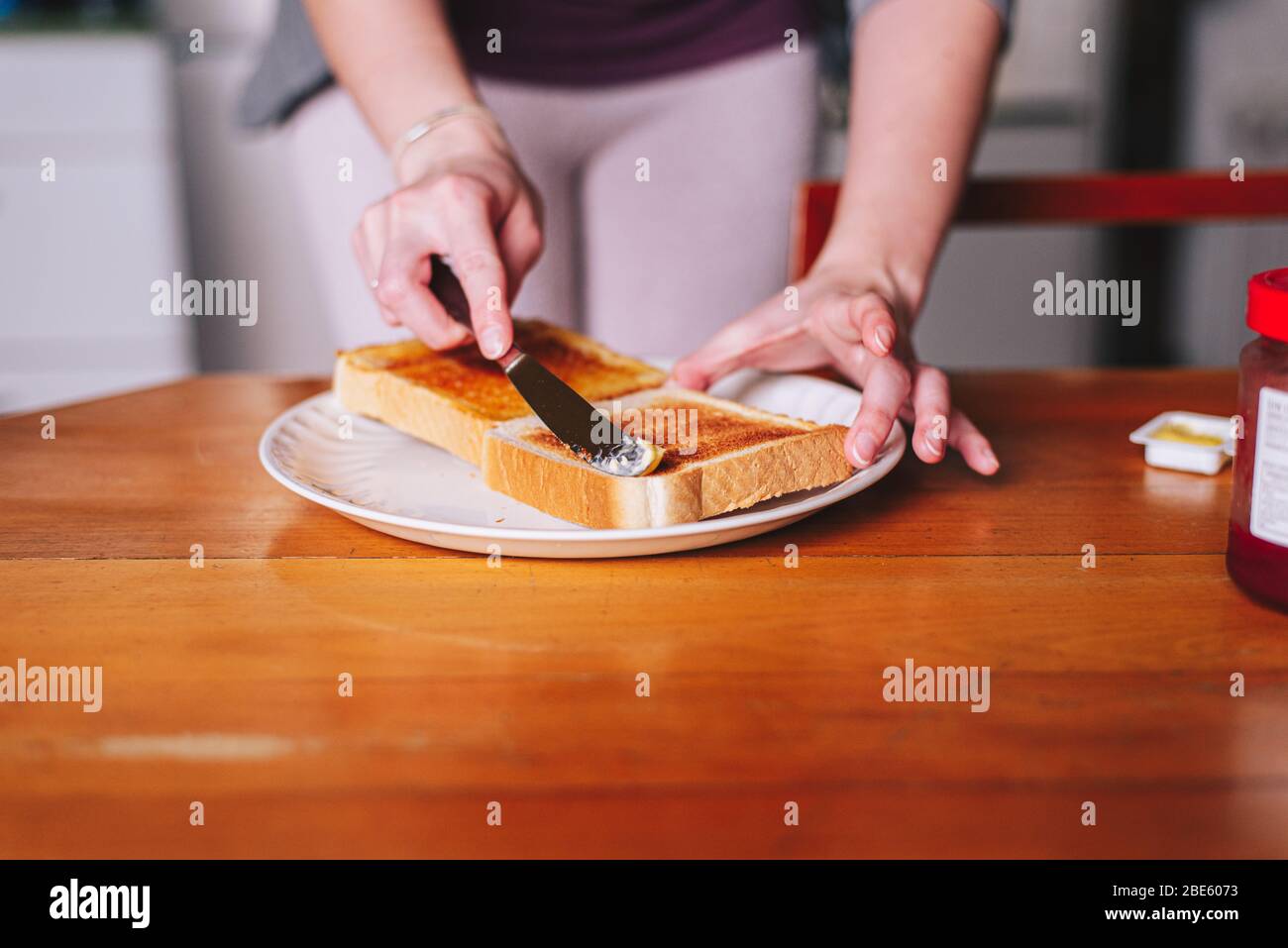 Spreading butter on toast hi-res stock photography and images - Alamy