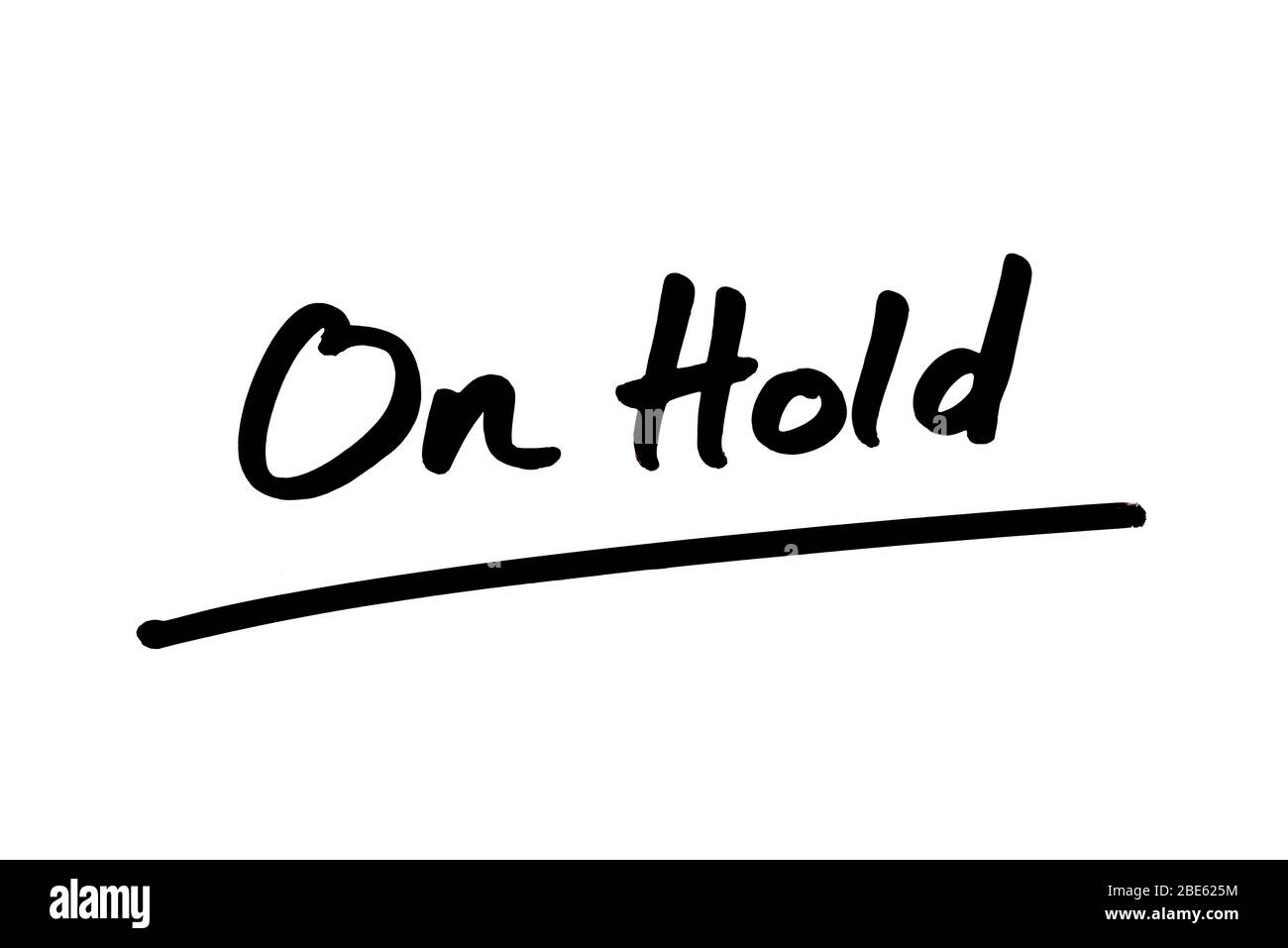 On Hold handwritten on a white background Stock Photo - Alamy