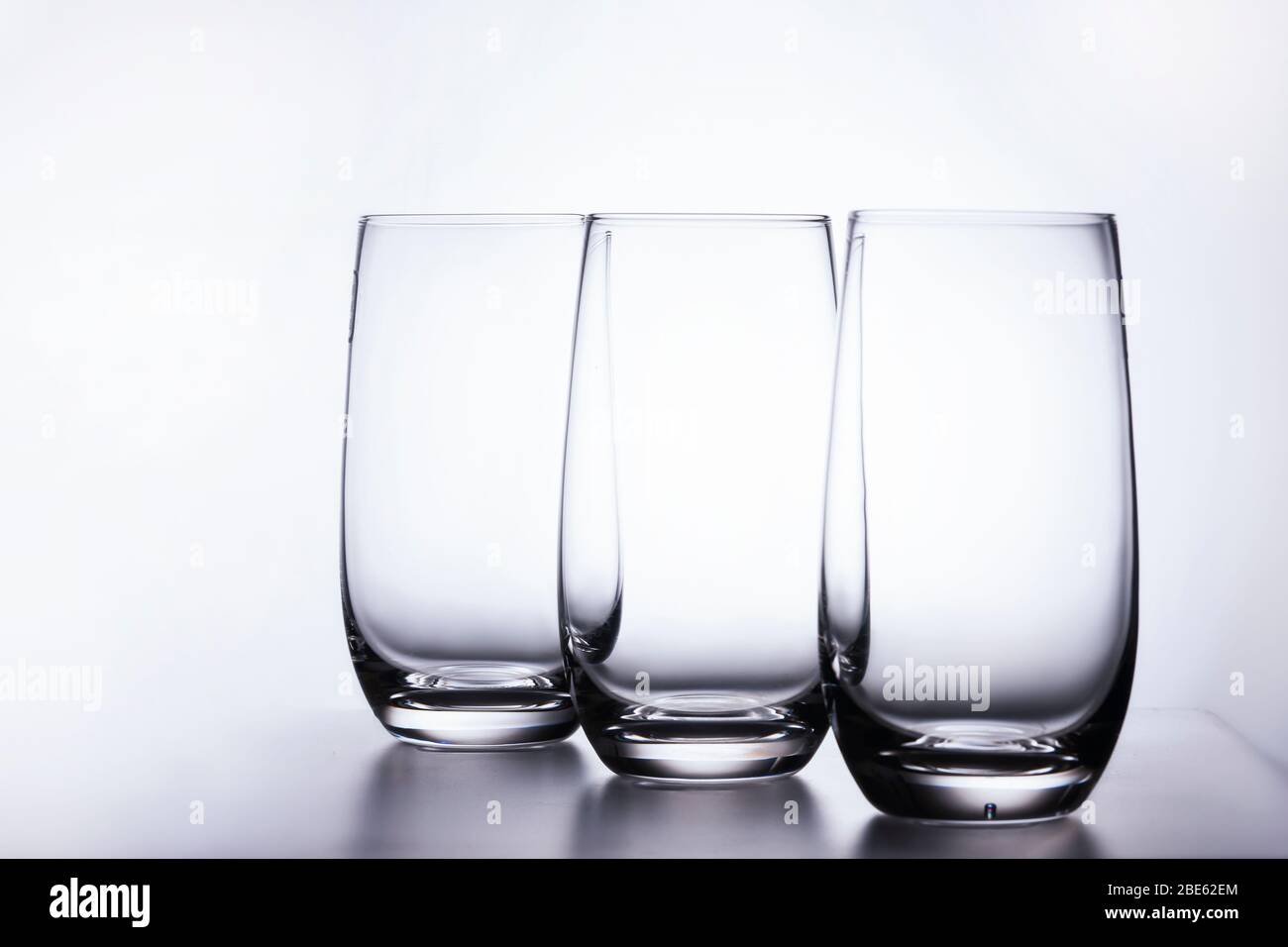 three empty glass glasses on a white background. Close up Stock Photo ...