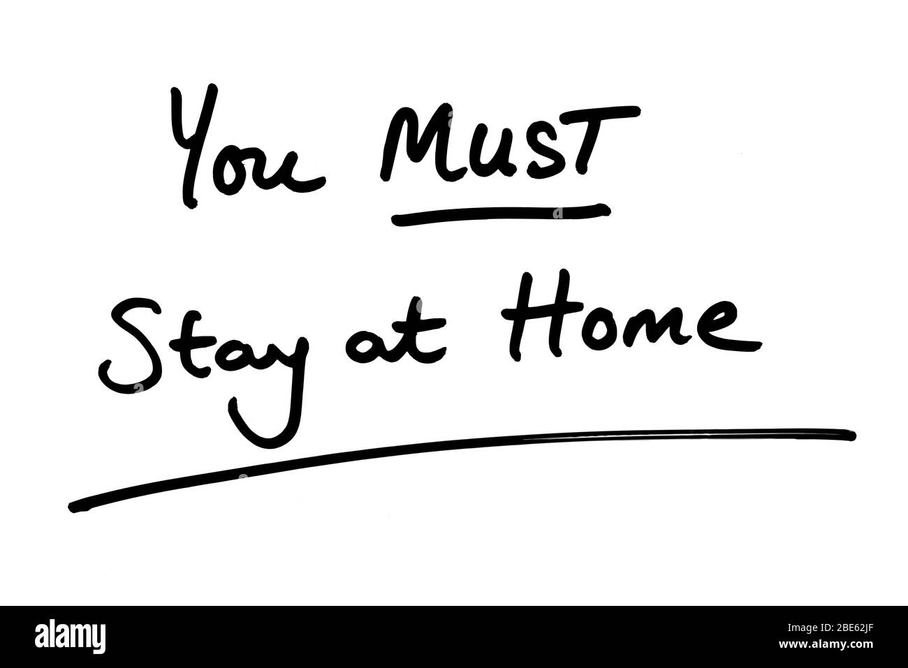 You MUST Stay at Home handwritten on a white background Stock Photo - Alamy