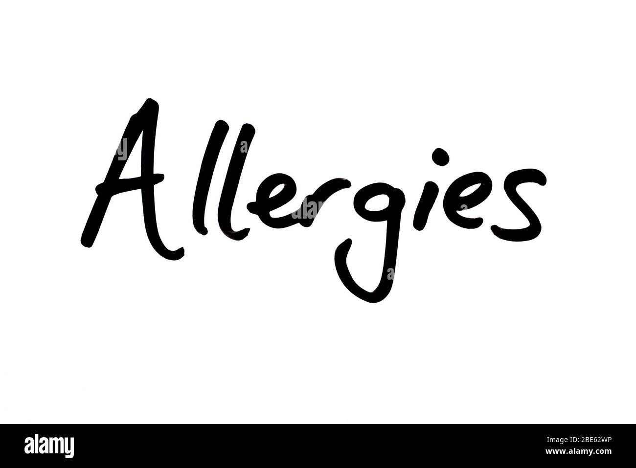 The word Allergies handwritten on a white background Stock Photo - Alamy