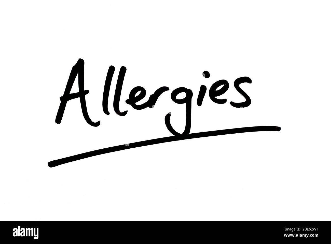 The word Allergies handwritten on a white background Stock Photo - Alamy