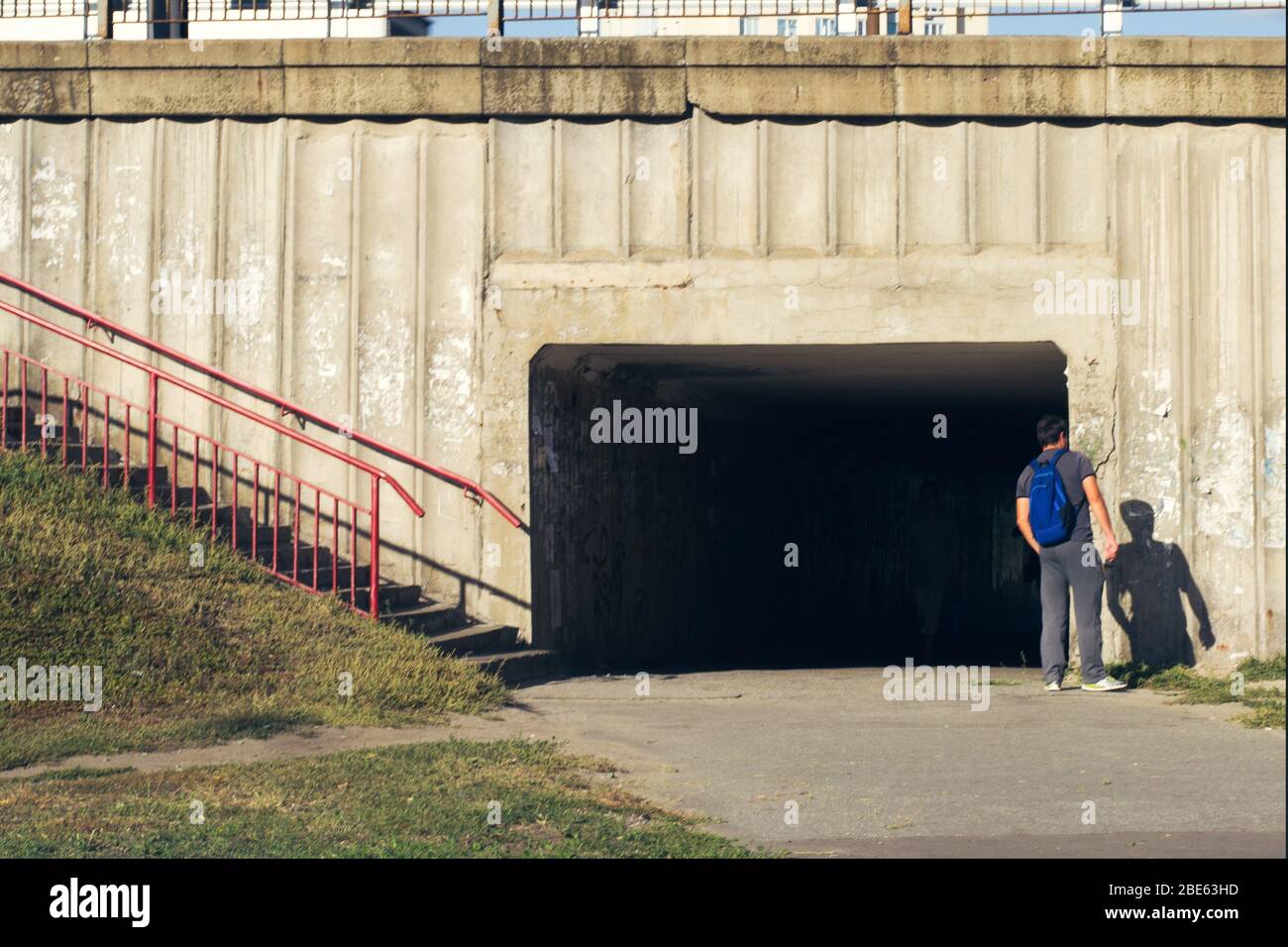 A man waiting for someone standing near an underground passage Stock ...