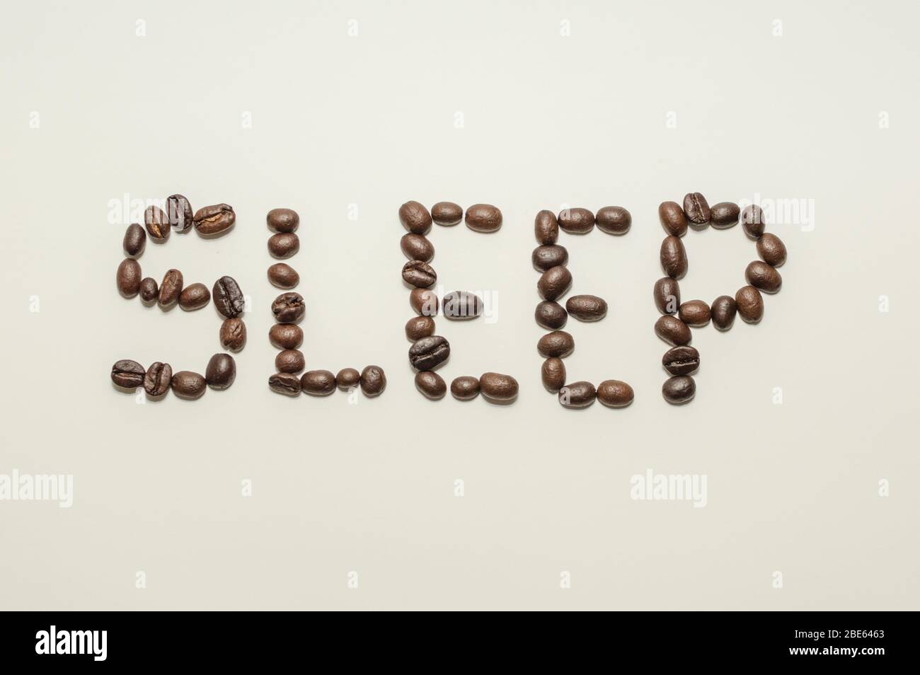 Coffee beans spelling the word "sleep" against a white background Stock ...