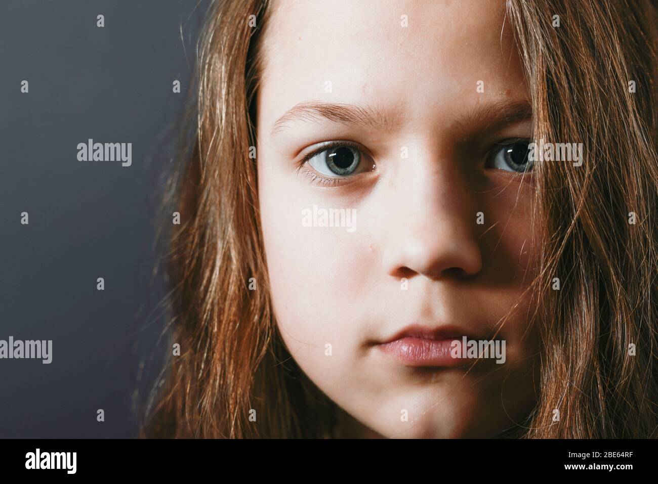 closeup portrait of serious child girl Stock Photo - Alamy