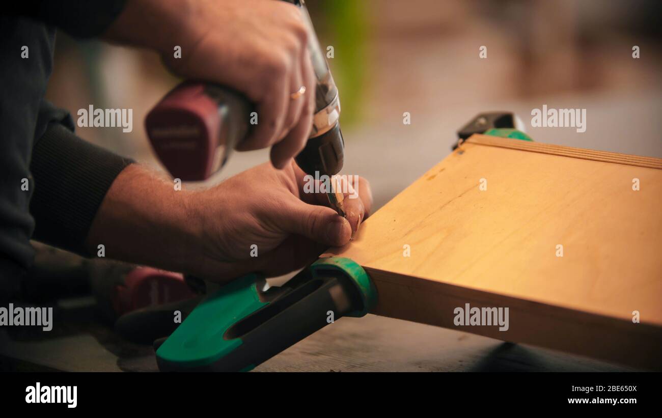 Carpentry working man worker drills hi-res stock photography and images ...