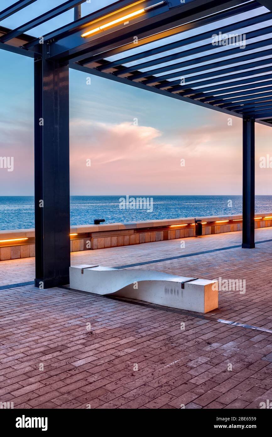 Sea promenade with pergola and bench at dusk in Monaco, Europe Stock ...