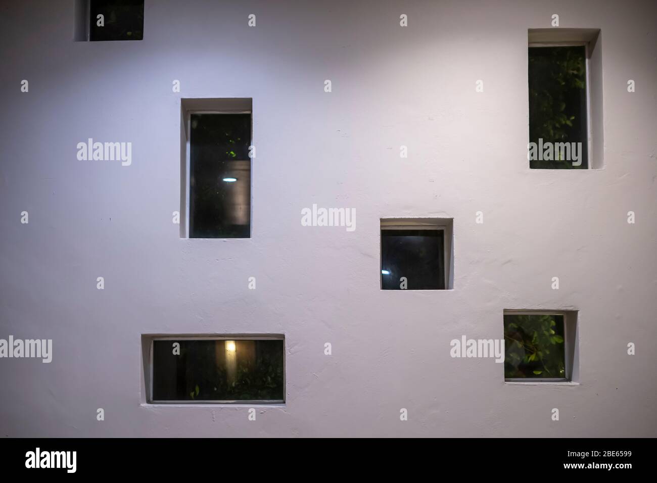 The building of minimal construction is a concrete white wall with ...