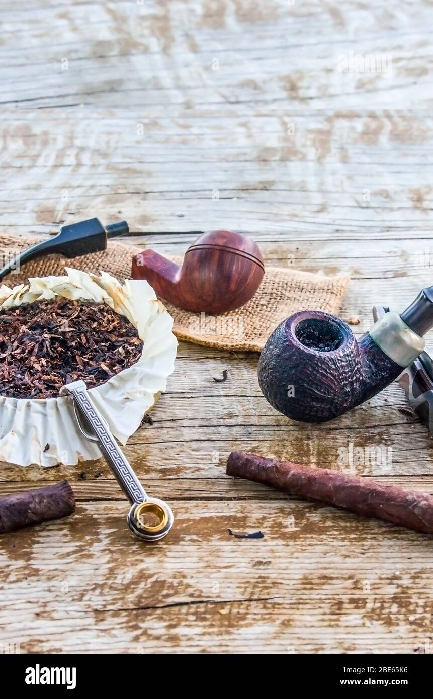 pleasure and enjoyment of slow smoking, its tools, pipe, tobacco, cigar ...
