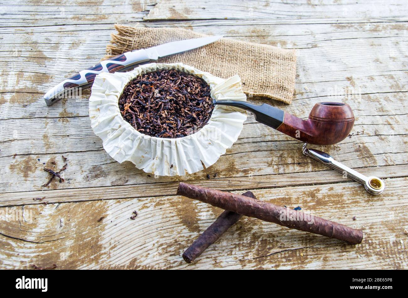 pleasure and enjoyment of slow smoking, its tools, pipe, tobacco, cigar ...