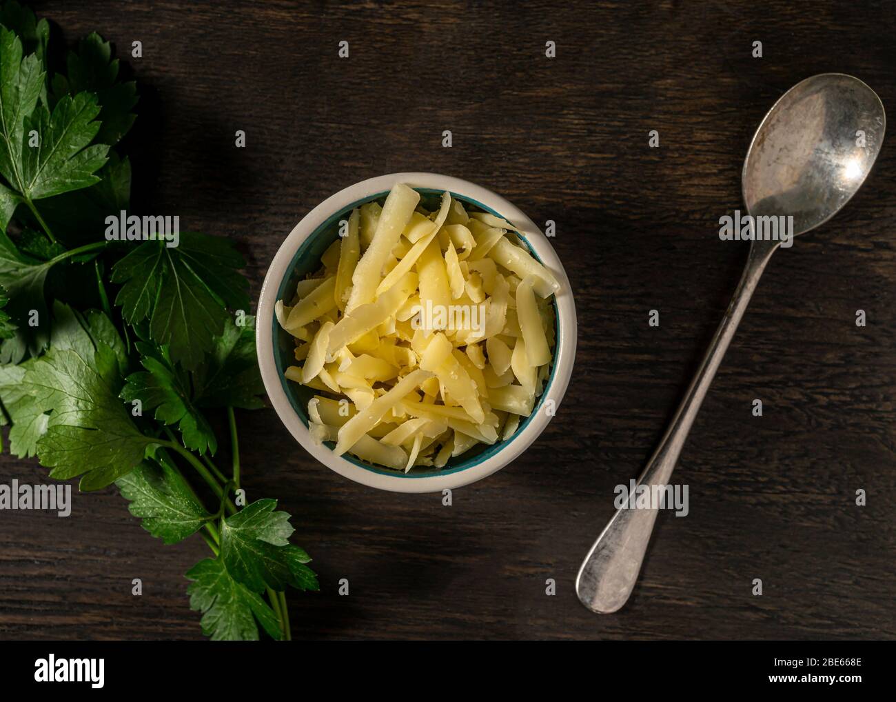 Bowl of shredded Asiago cheese Stock Photo - Alamy