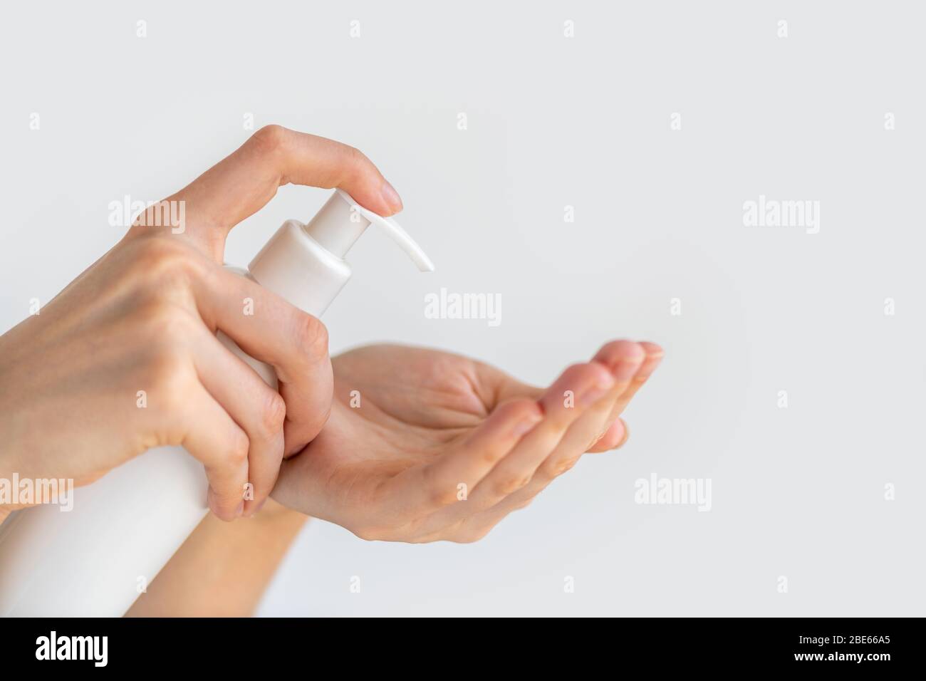 Female person woman or girl applying soap disinfectant product on hand ...