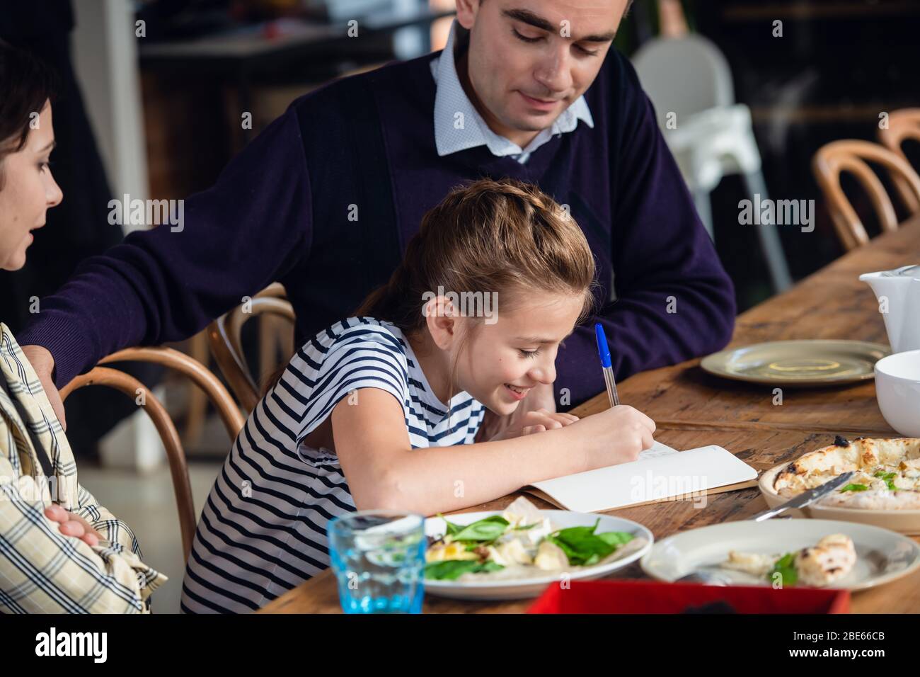 Child studying at breakfast table hi-res stock photography and images ...