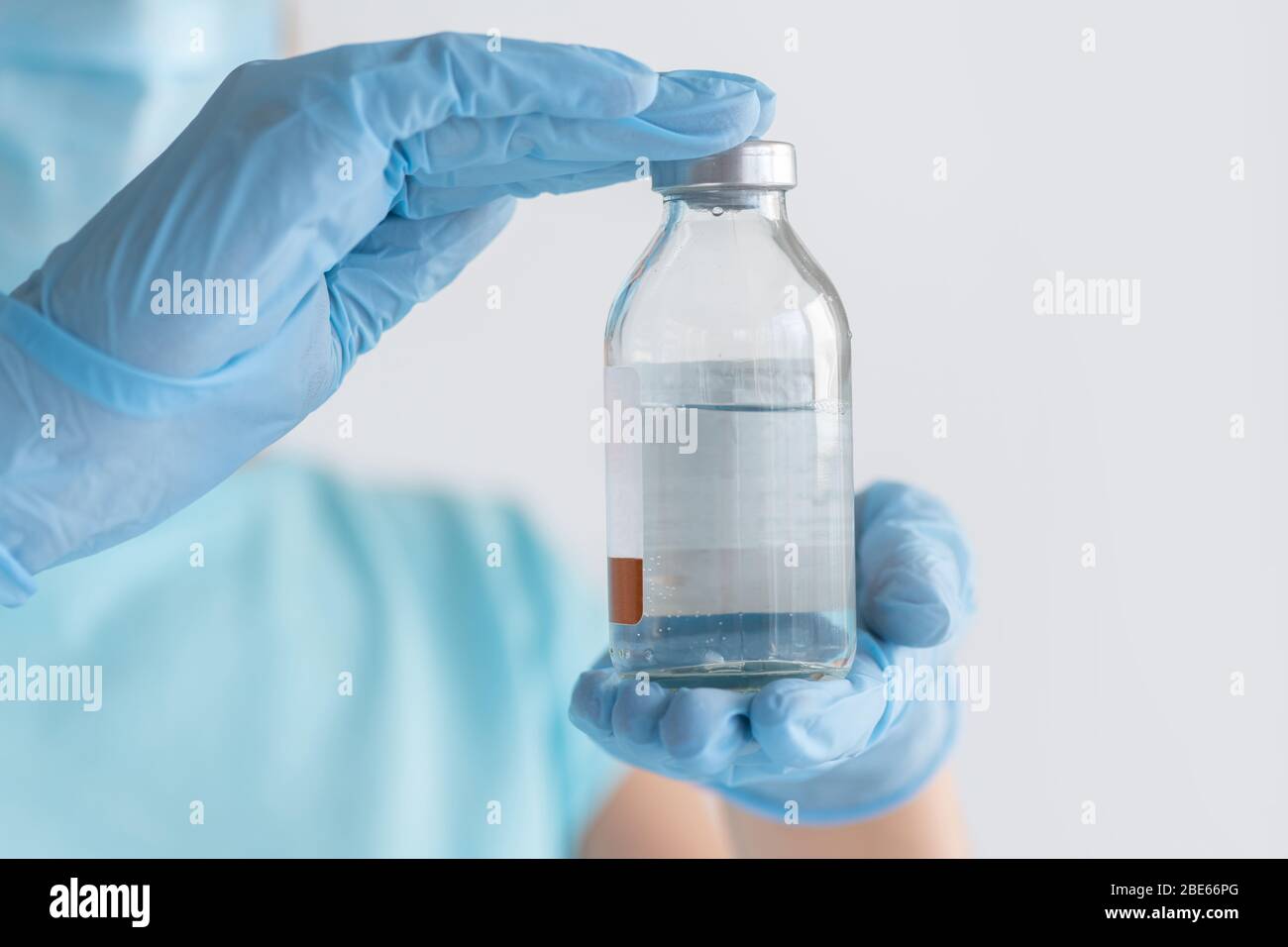 Bottle for injection in nurse hand. Medical glass vial for vaccination ...
