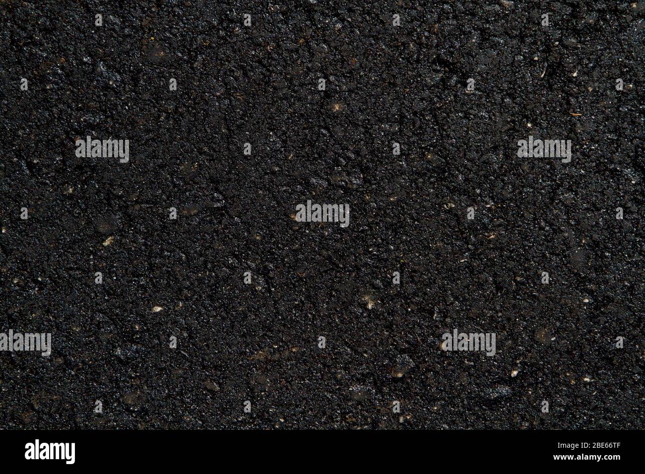 Pressed rolled bitumen asphalt. The texture of the surface of the ...