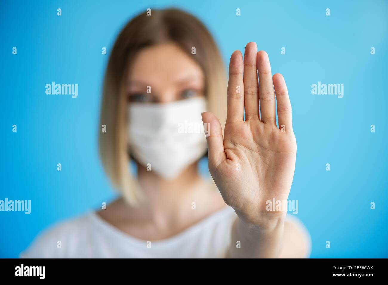 Attractive female nurse showing stop sign with his hand gesture ...