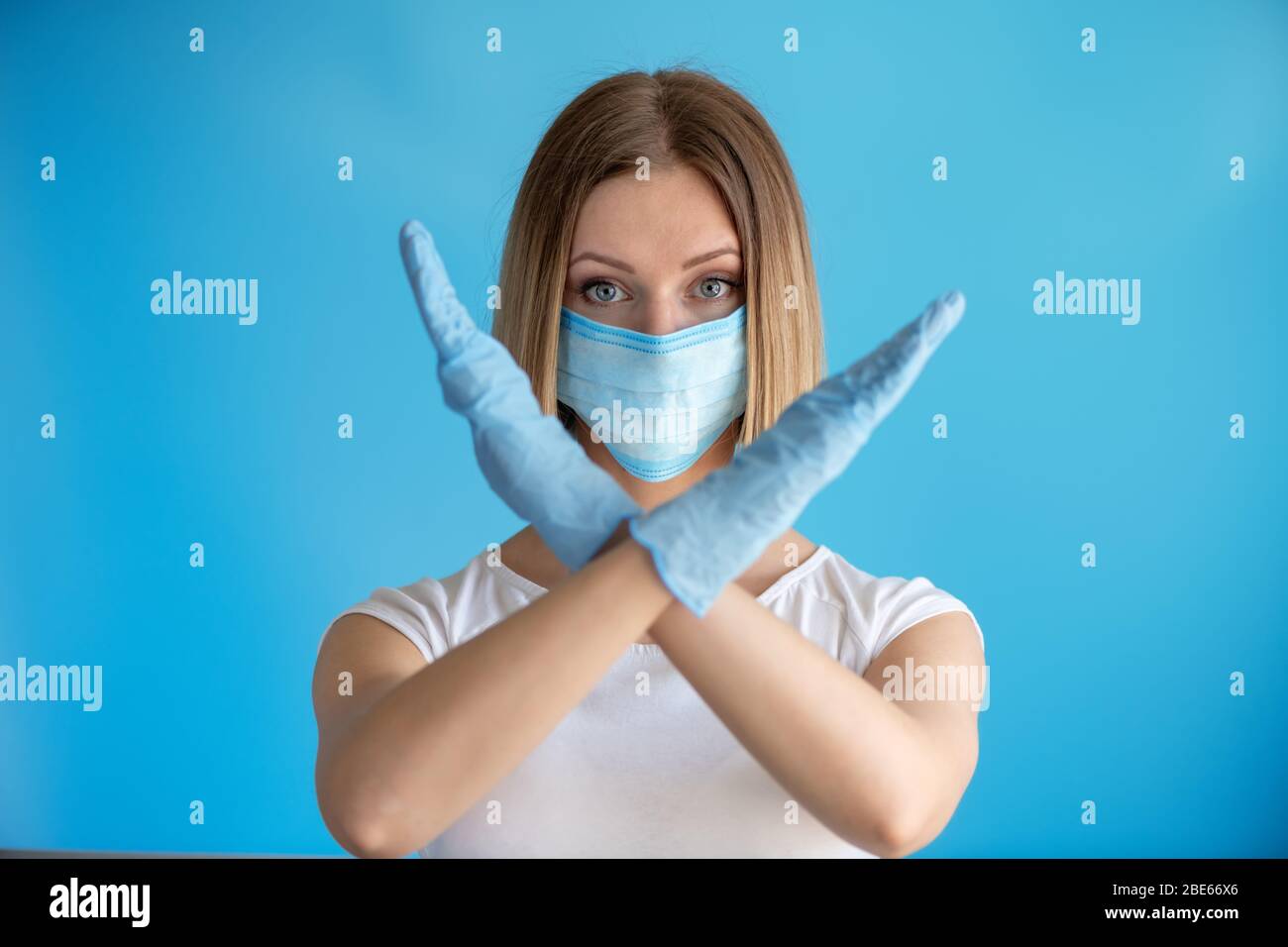 Attractive female nurse showing stop sign with his hand gesture ...