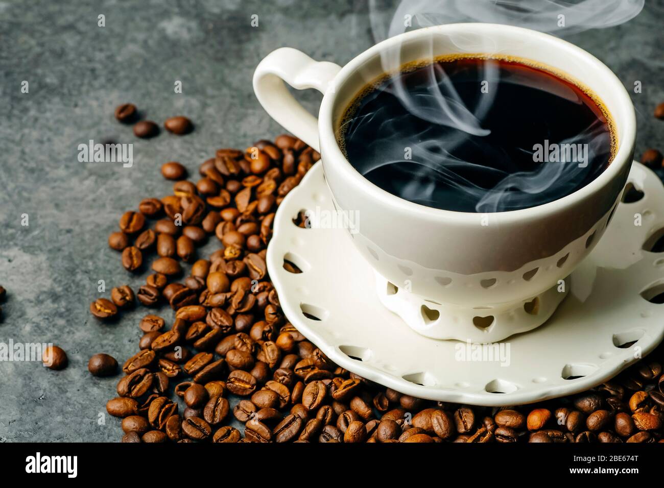Coffee background. Coffee beans and cup on dark backgrpund. Coffee ...