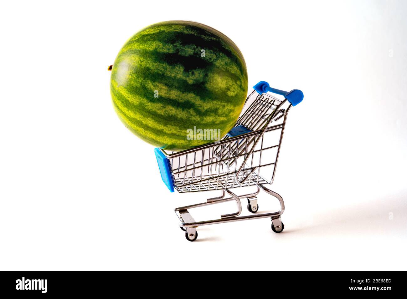 Front view green Watermelon on shopping trolley isolated on white ...