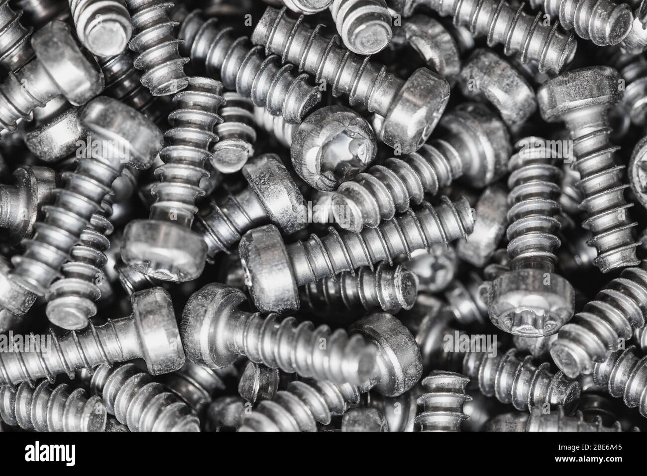 Macro concept, a lot of tapping metal or iron screws, screws as ...