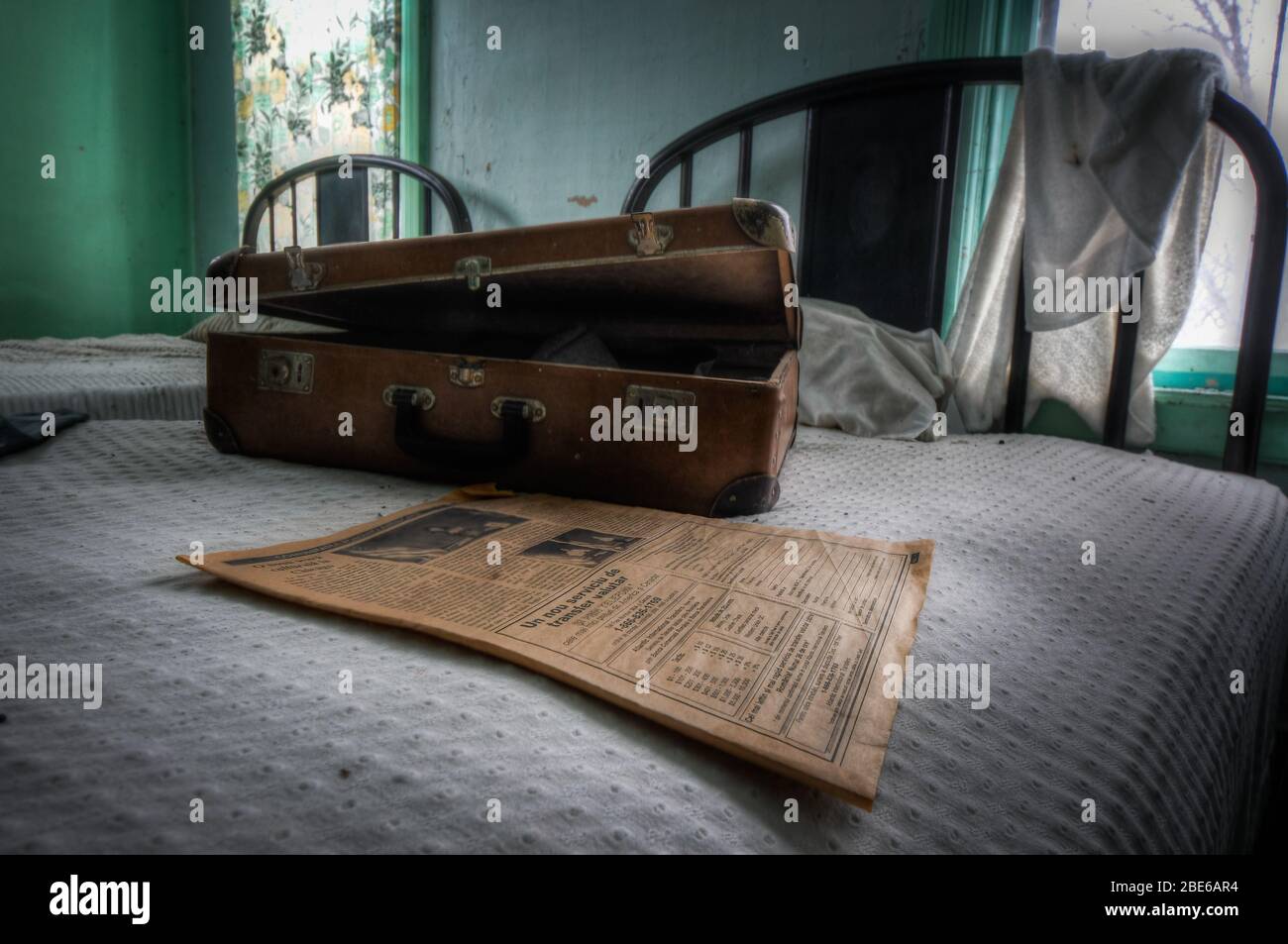 Suitcase and Newspaper in Hotel Room of an Abandoned Hotel in United ...
