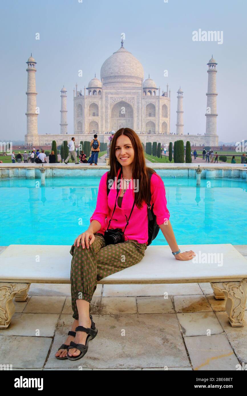 Young woman sitting on a bench at Taj Mahal complex in Agra, Uttar ...